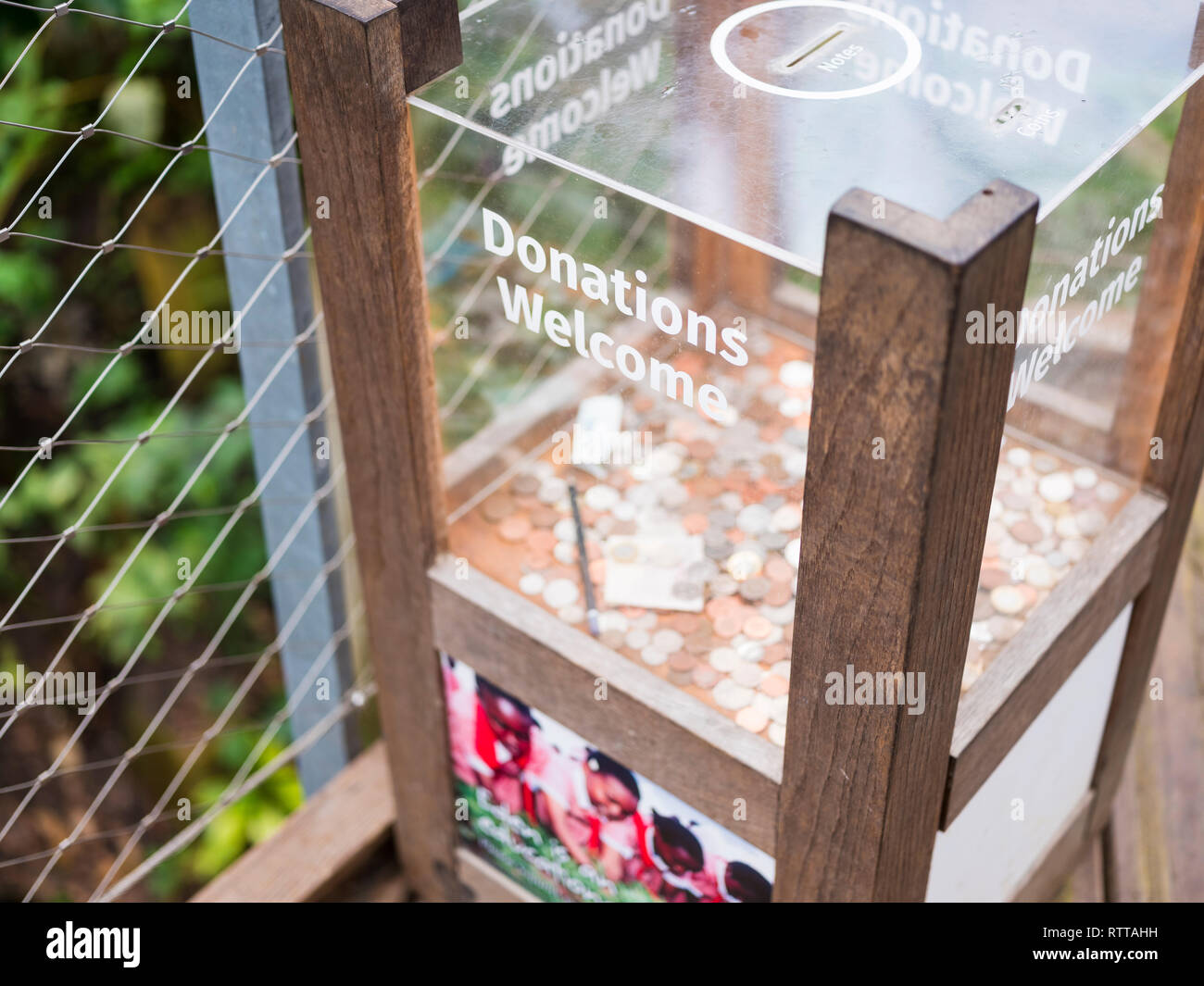 A donations box in the Rainforest at the Eden Project Stock Photo - Alamy