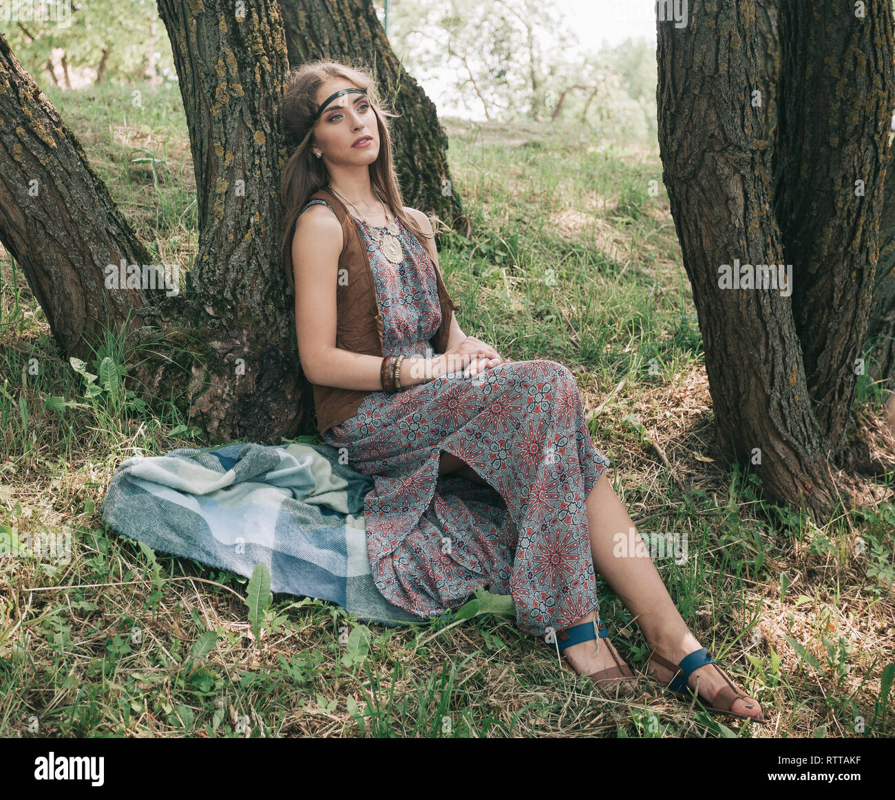Hippie girl in nature sitting hi-res stock photography and images - Alamy