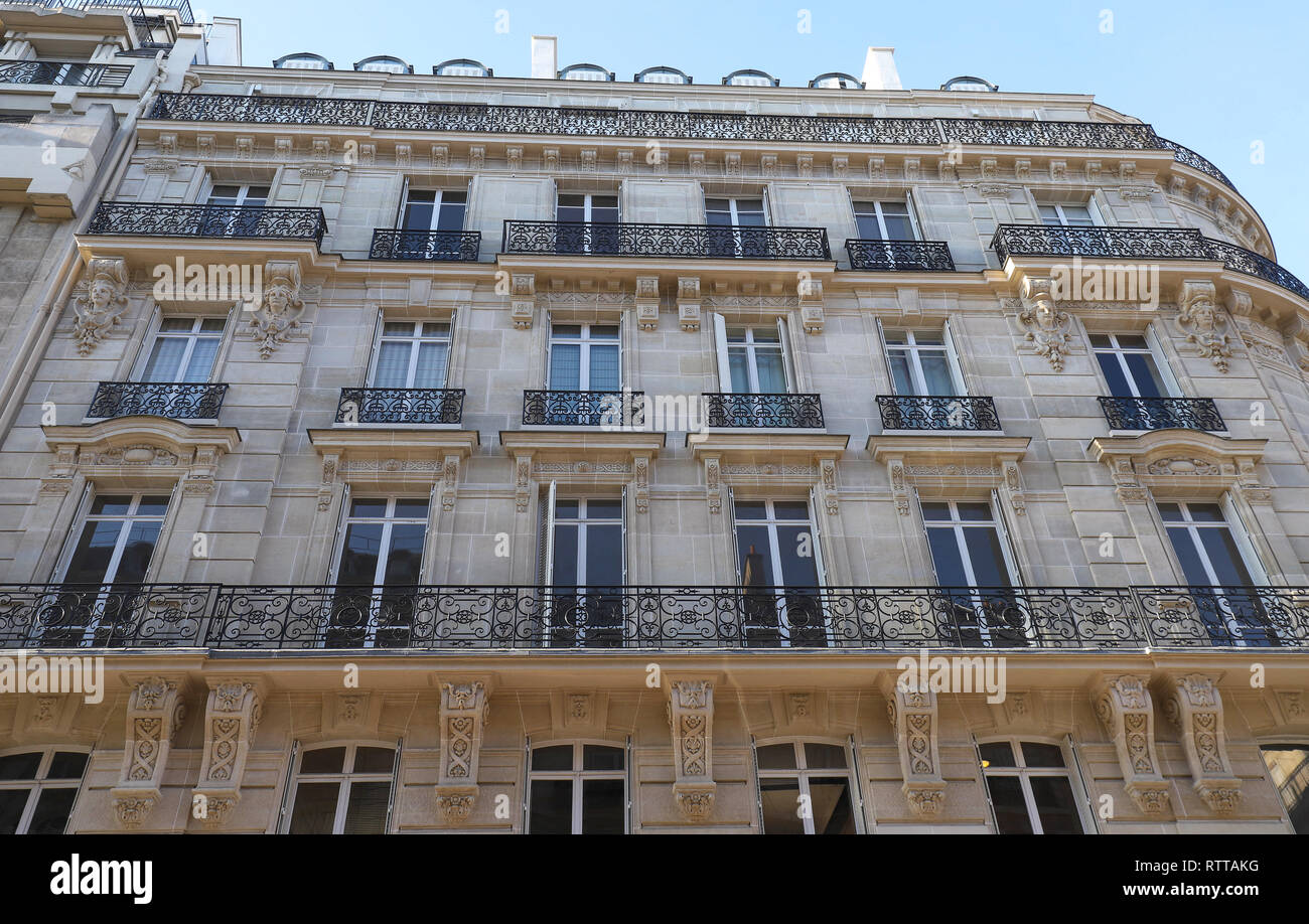 Traditional French house with typical balconies and windows. Paris ...