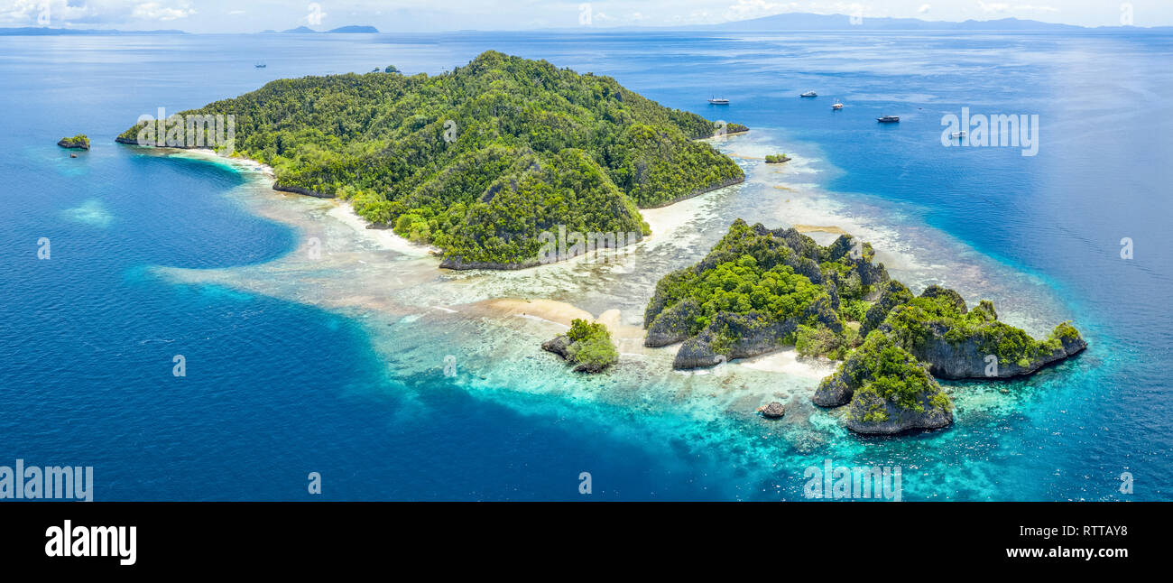 aerial view of limestone islands, surrounded by coral reefs, Raja Ampat ...