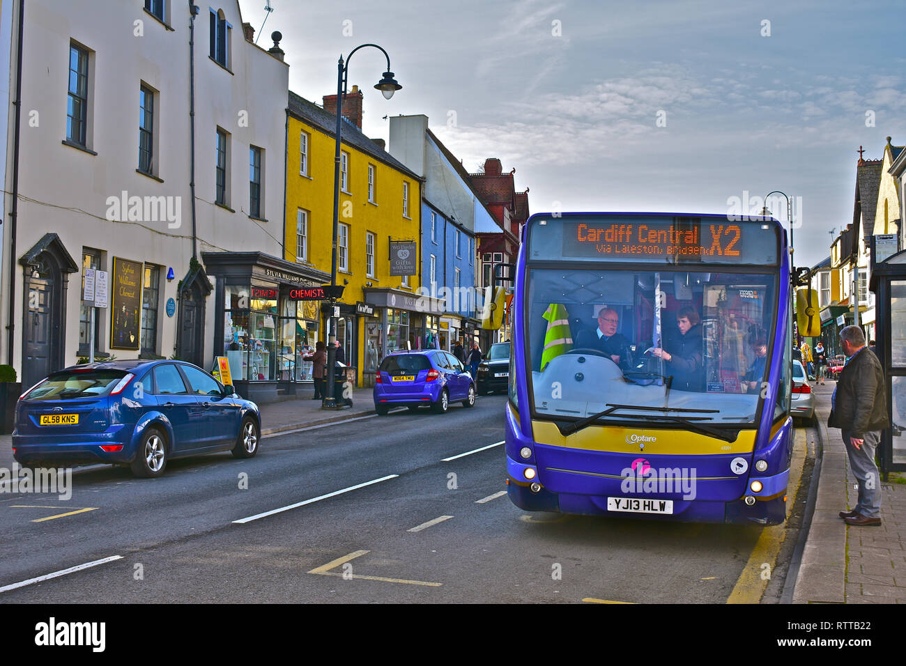Passengers board a local bus in Cowbridge town centre, en route to ...