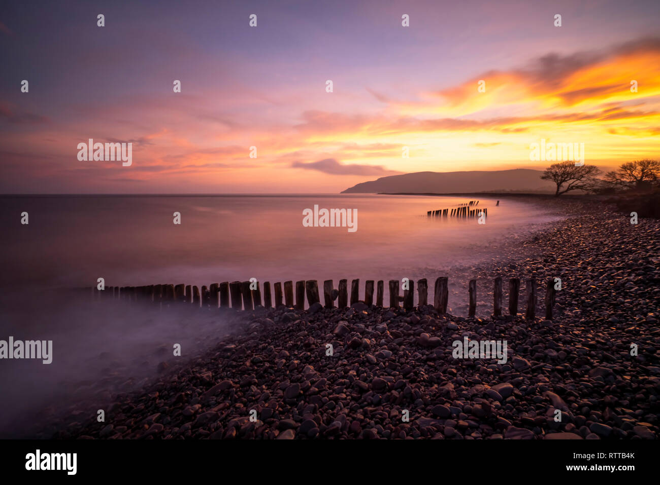 Porlock Weir Beach and Water Breaks Stock Photo - Alamy