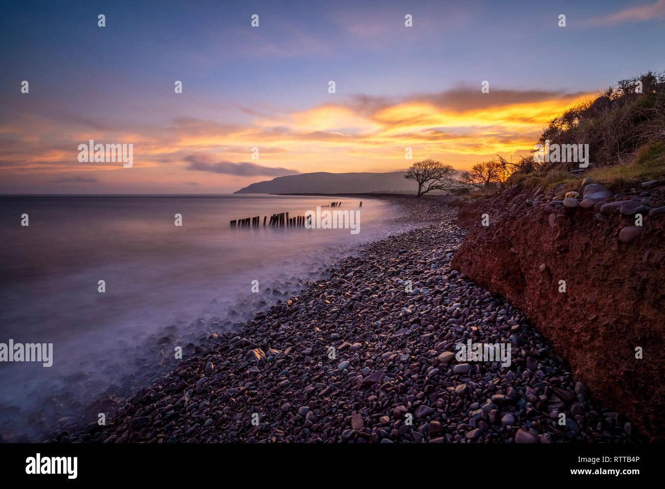 Porlock Weir Beach and Water Breaks Stock Photo - Alamy