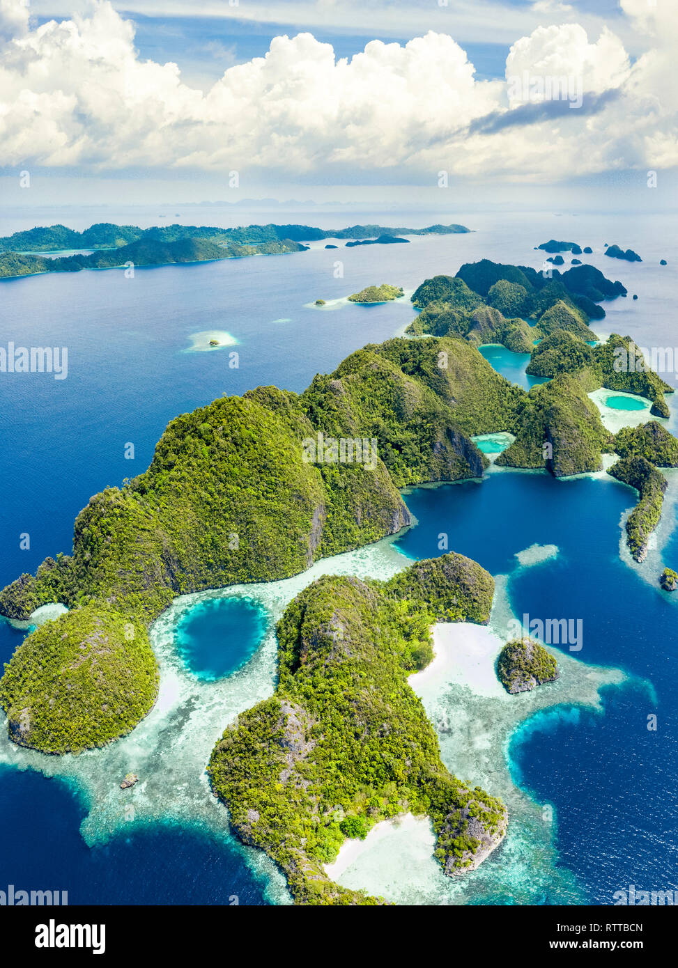 aerial view of a remote set of limestone islands, surrounded by ...