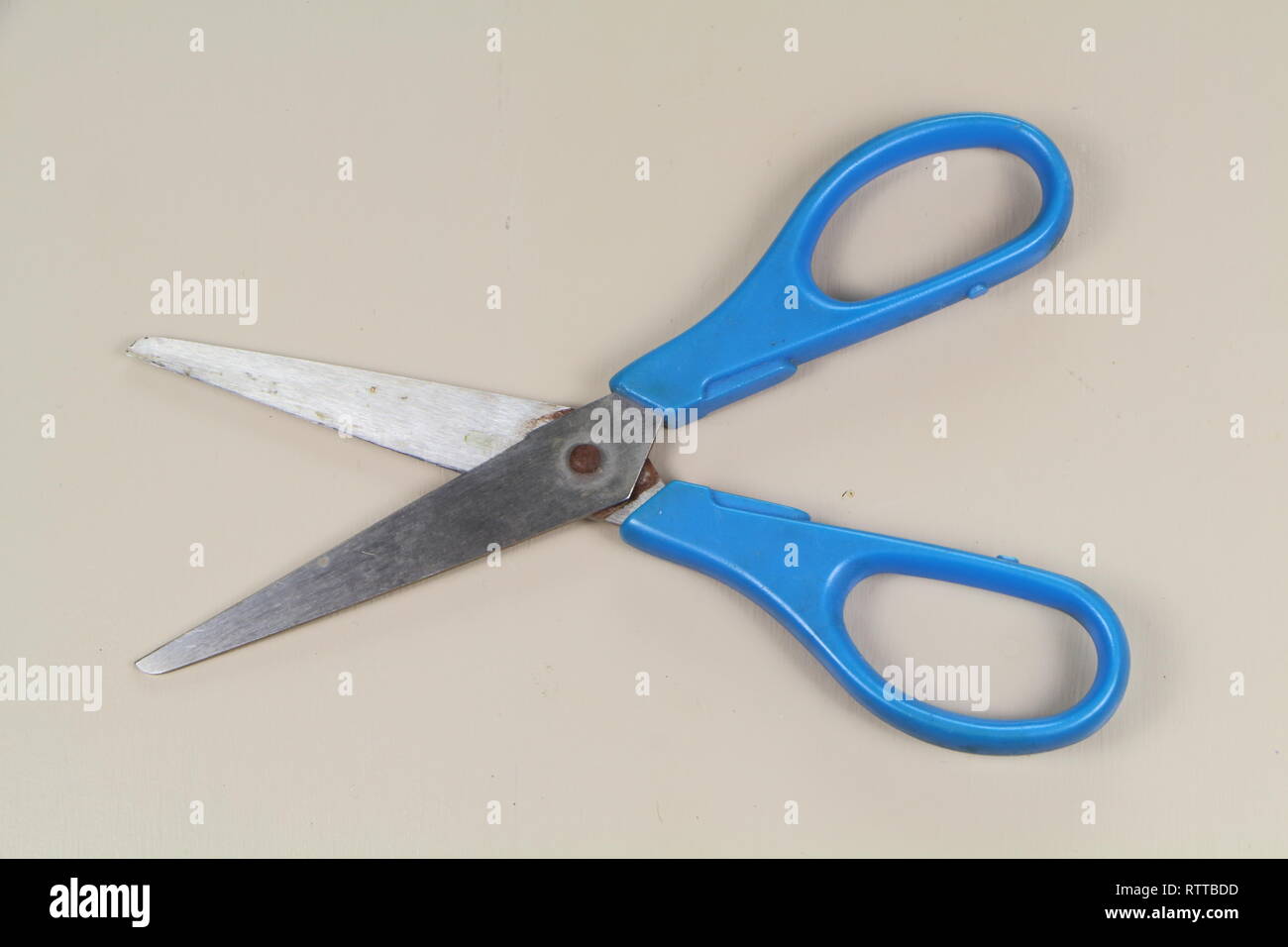 Open pair of blue scissors for child Stock Photo - Alamy