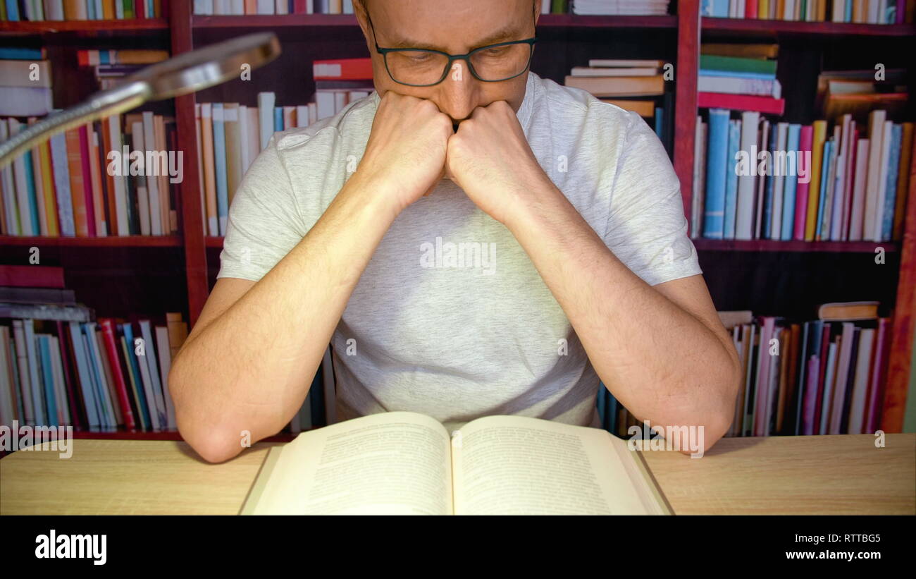 Man reading at the desk with lamp Stock Photo - Alamy