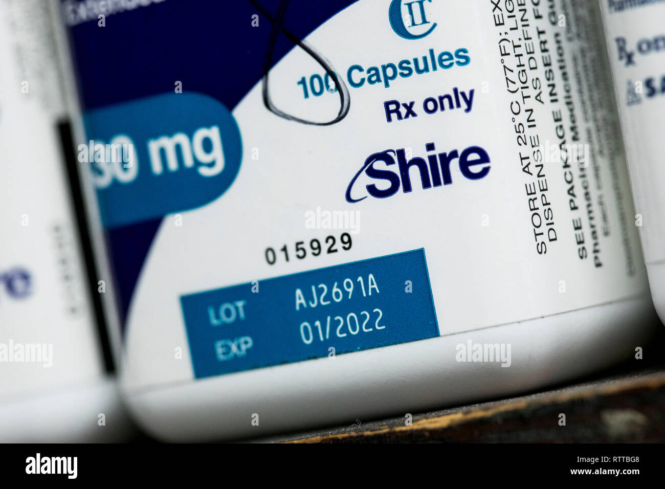 A Shire logo is seen on prescription pharmaceutical packaging ...