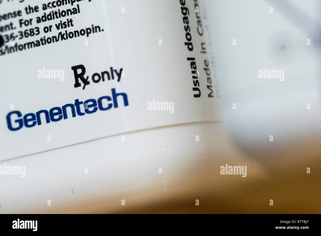 A Genentech logo is seen on prescription pharmaceutical packaging ...