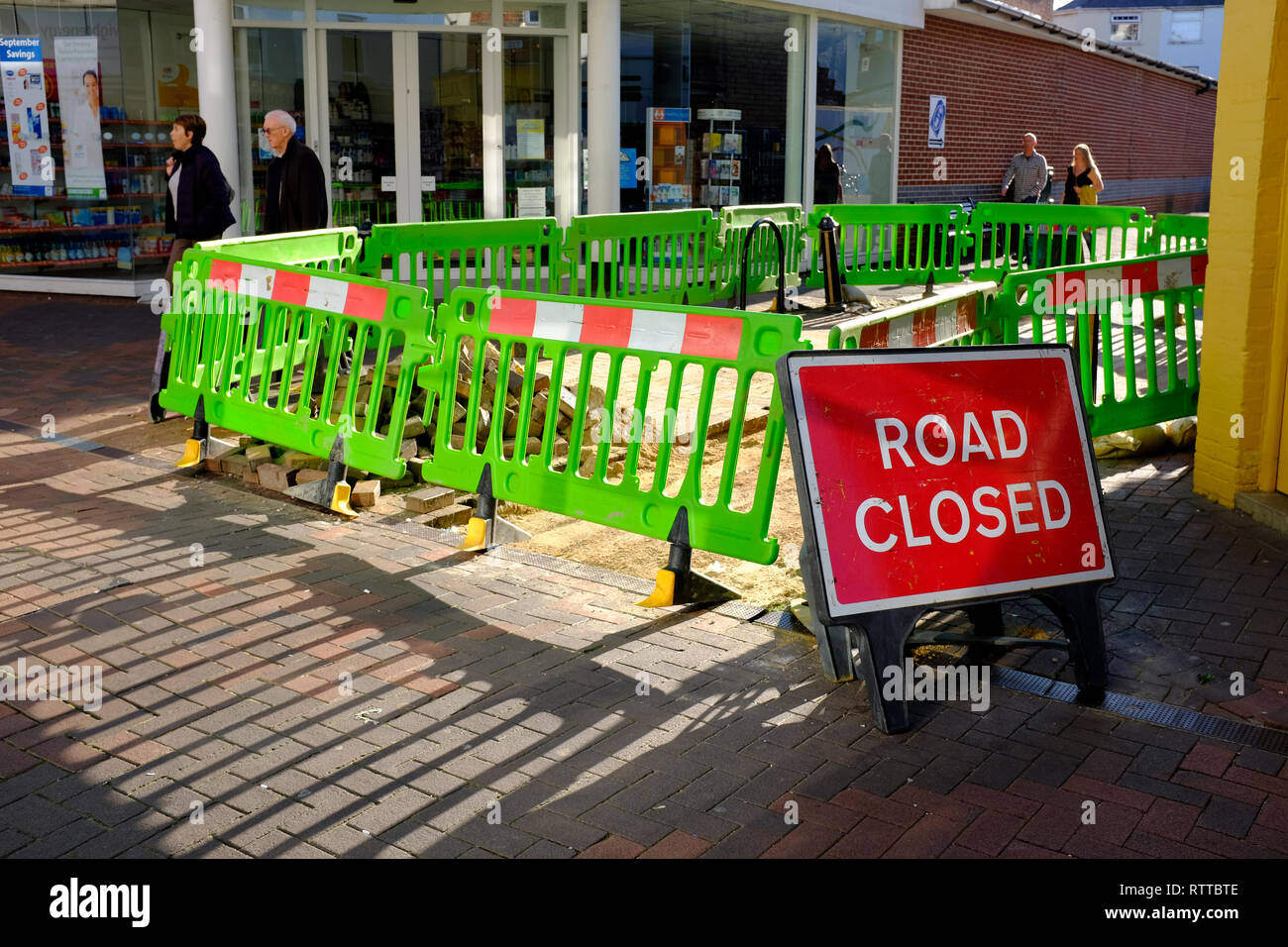 Cars pedestrians high street road works hi-res stock photography and ...