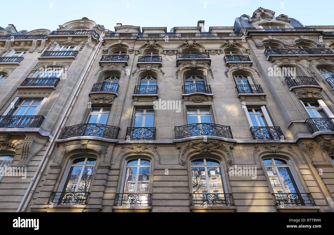 Traditional French house with typical balconies and windows. Paris ...