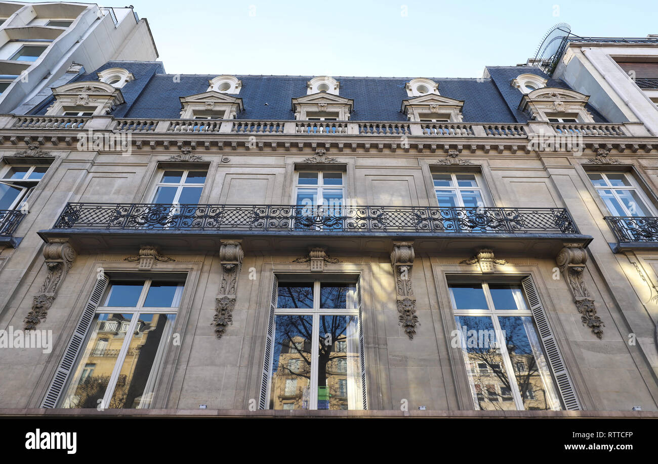 Traditional French house with typical balconies and windows. Paris ...
