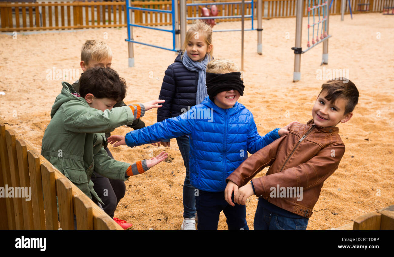 Children play in the blind man's buff Stock Photo - Alamy