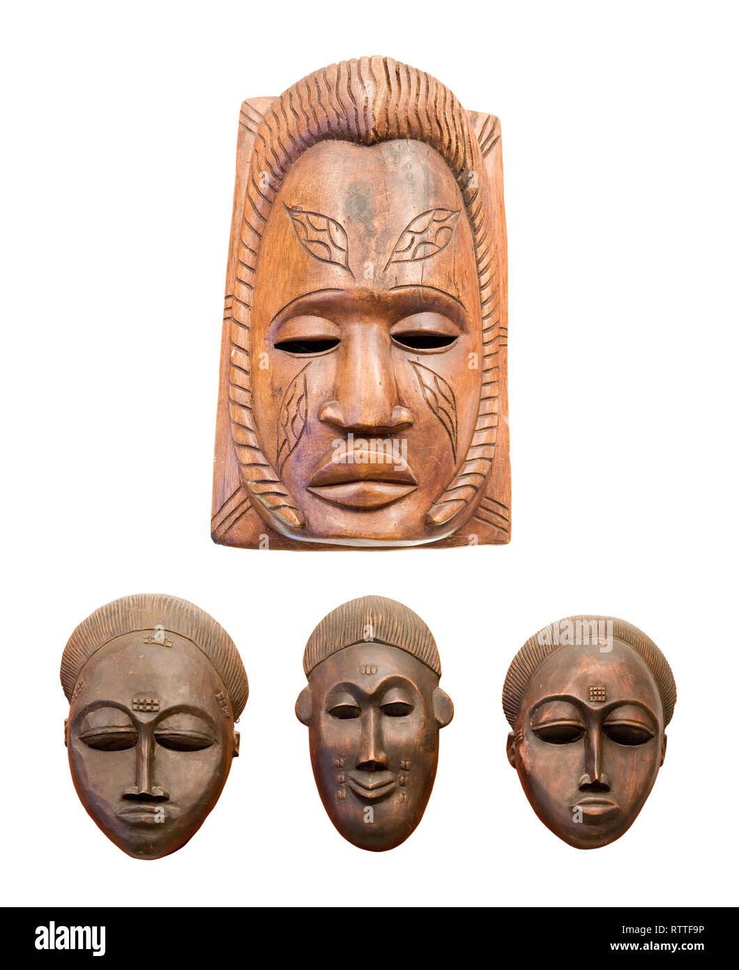 four african masks isolated on white background Stock Photo - Alamy