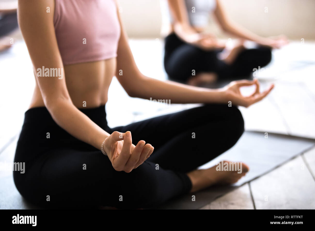 Woman and a group of people in Easy Seat pose Stock Photo - Alamy