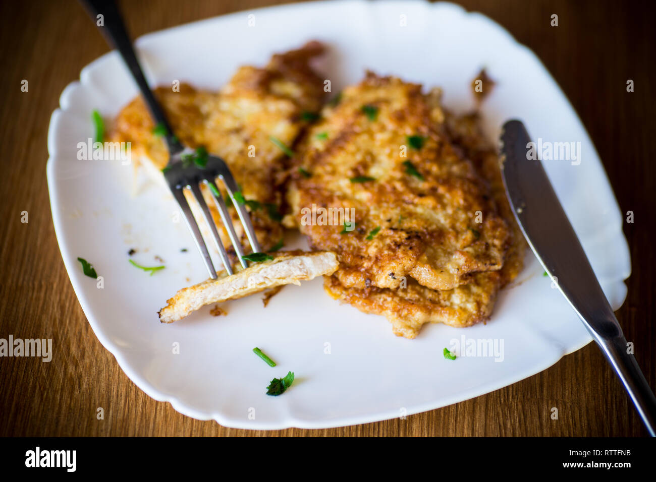 pork fillet chop fried in batter, in a plate Stock Photo - Alamy
