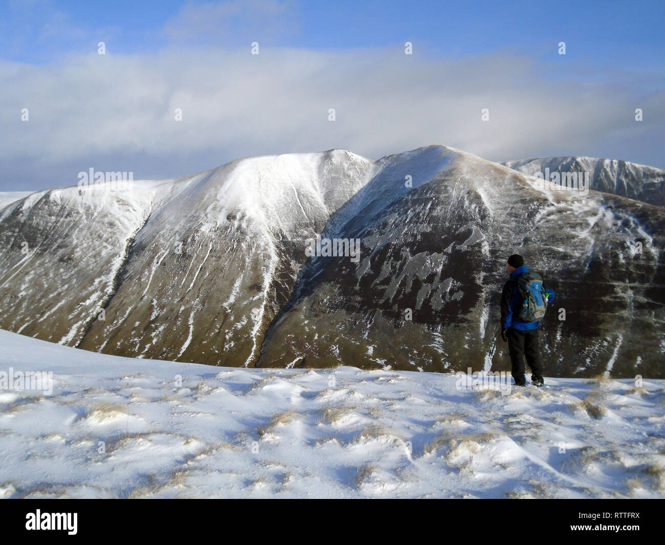 Lone Male Hiker in Snow with Saddle Yorke in the Background on Route to ...
