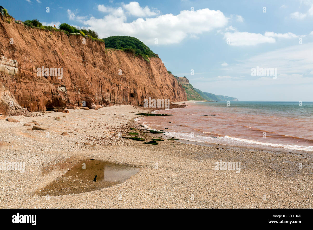 Looking east at the rock falls along the red sandstone cliffs on the ...
