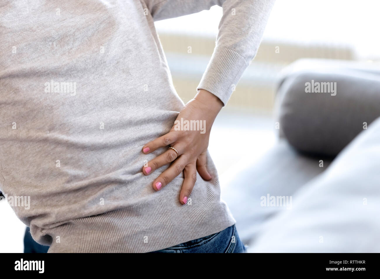 Close up tired woman suffering from backache, massaging back Stock ...