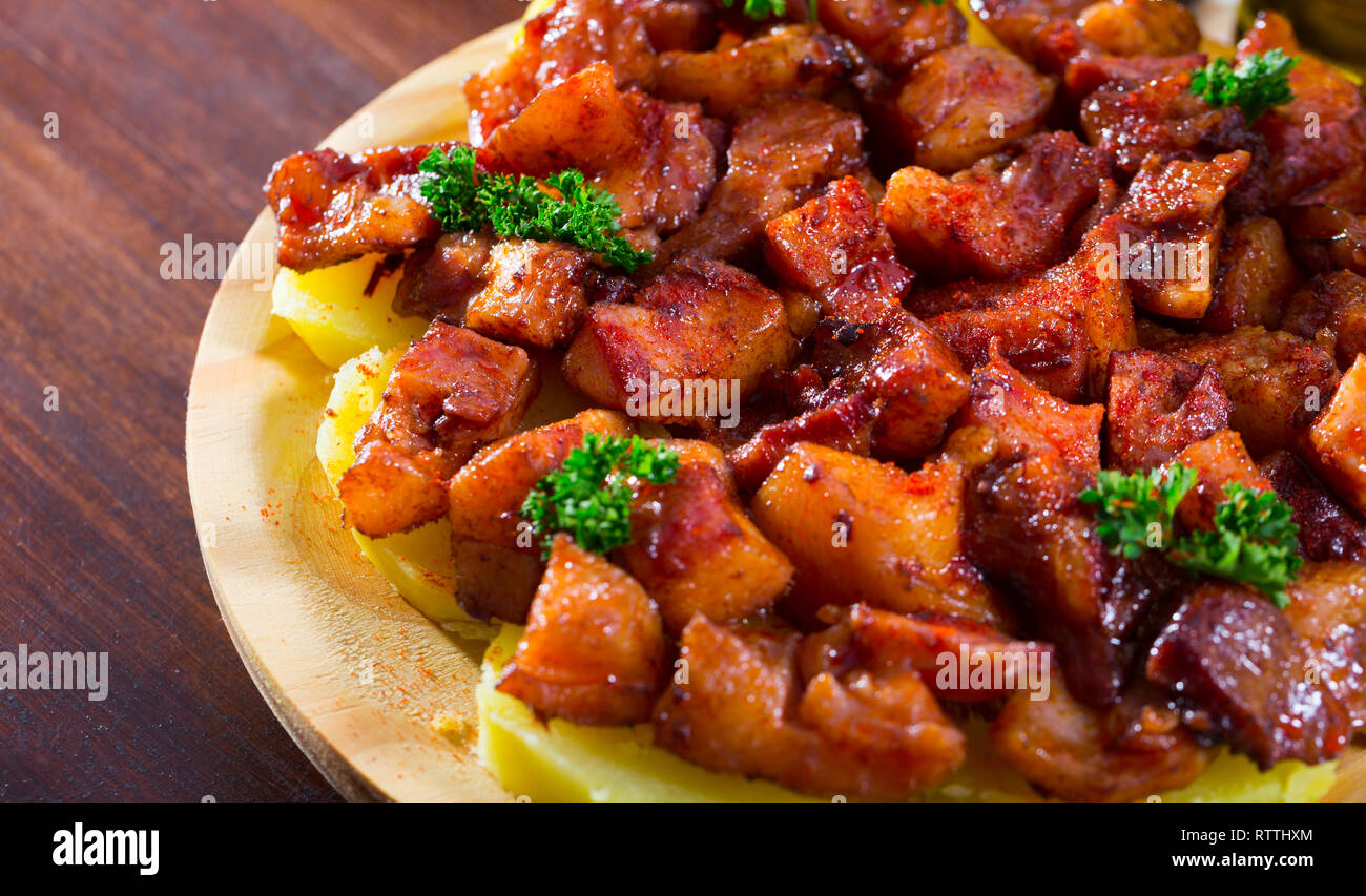 Roasted snouts of pigs with pepper on baked potato – Spanish dish Stock ...