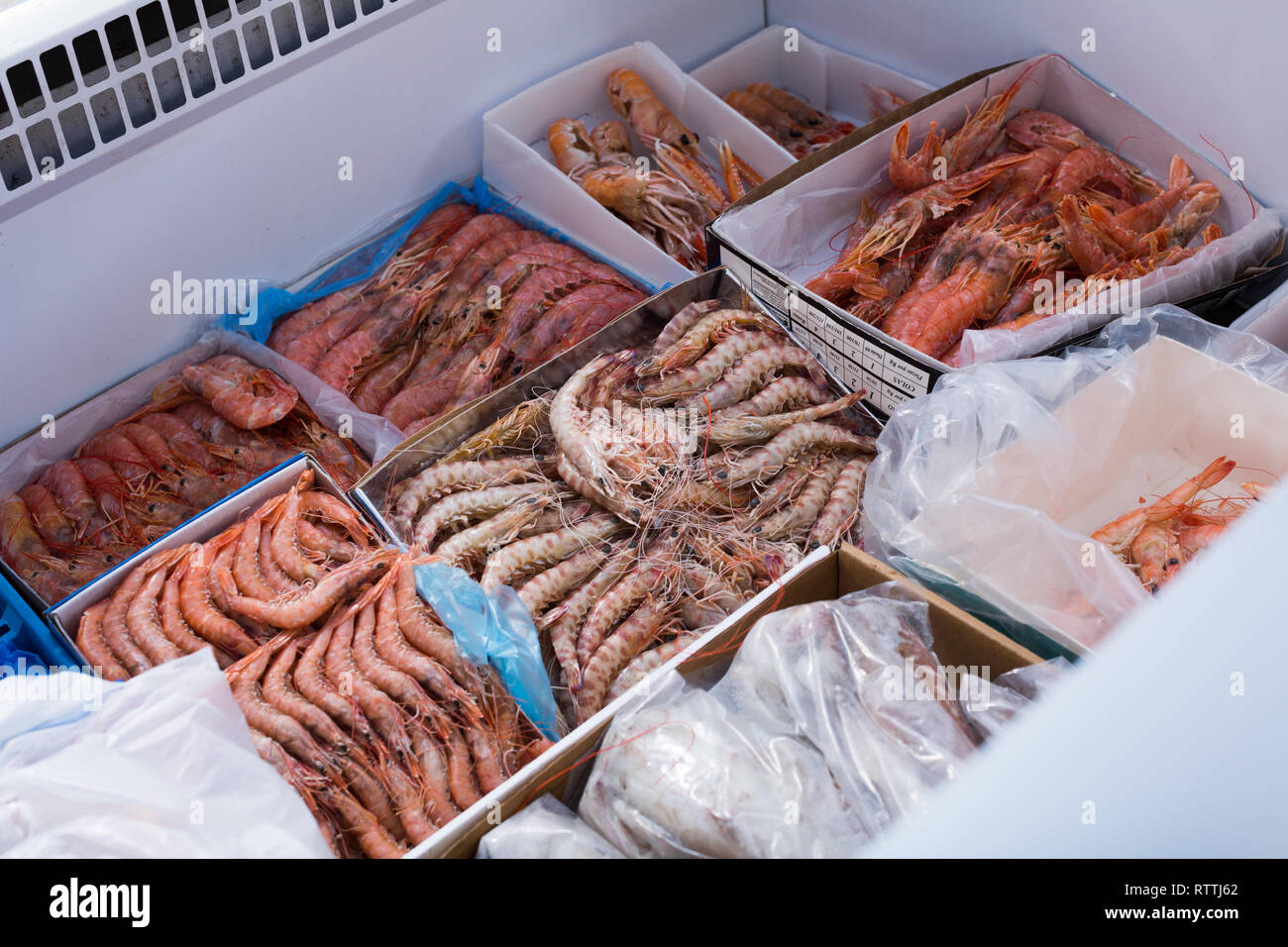 Assortment of cooled seefoods in show-case at fish market Stock Photo ...
