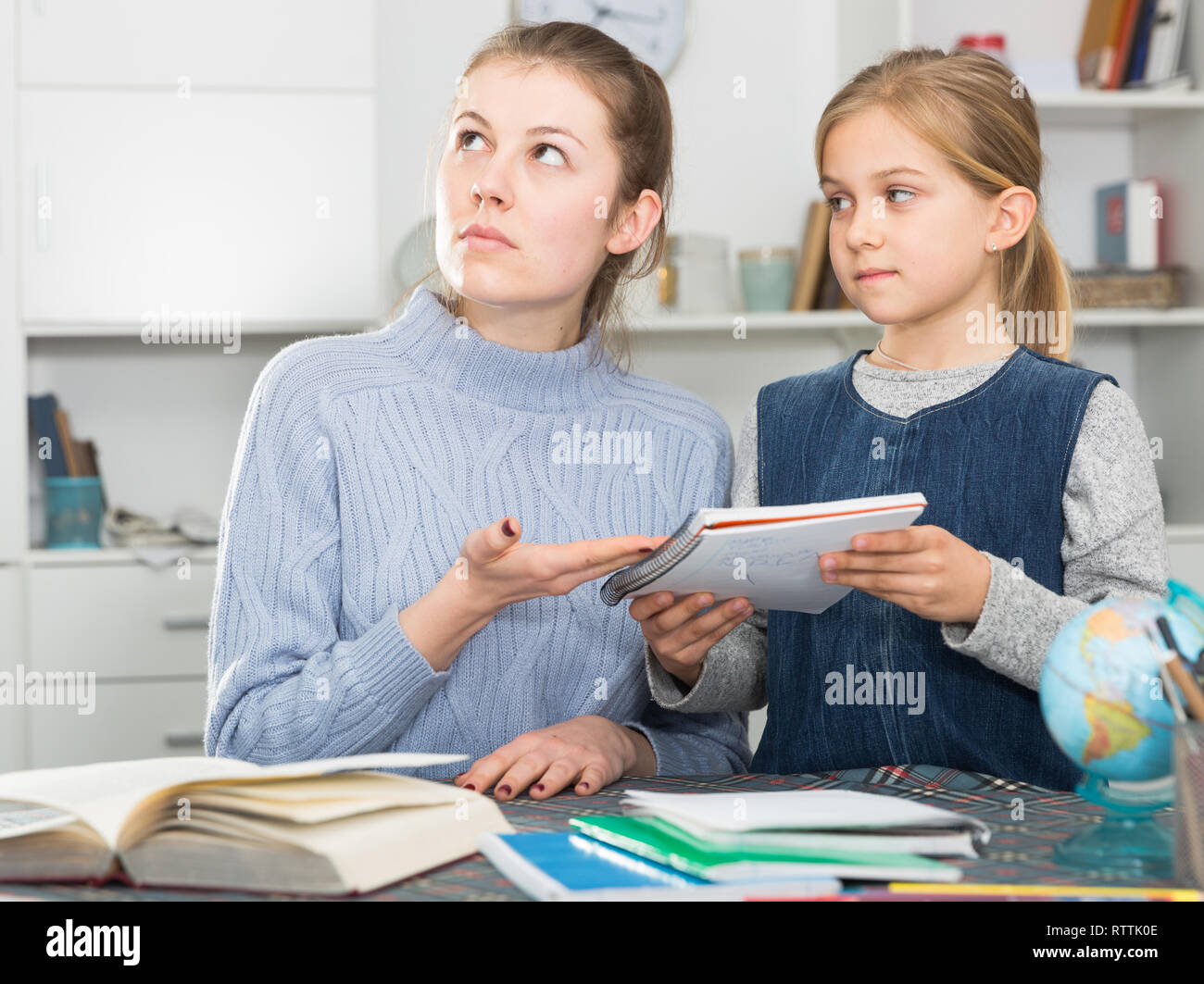 Mom scolds little daughter for poor grades in school Stock Photo - Alamy