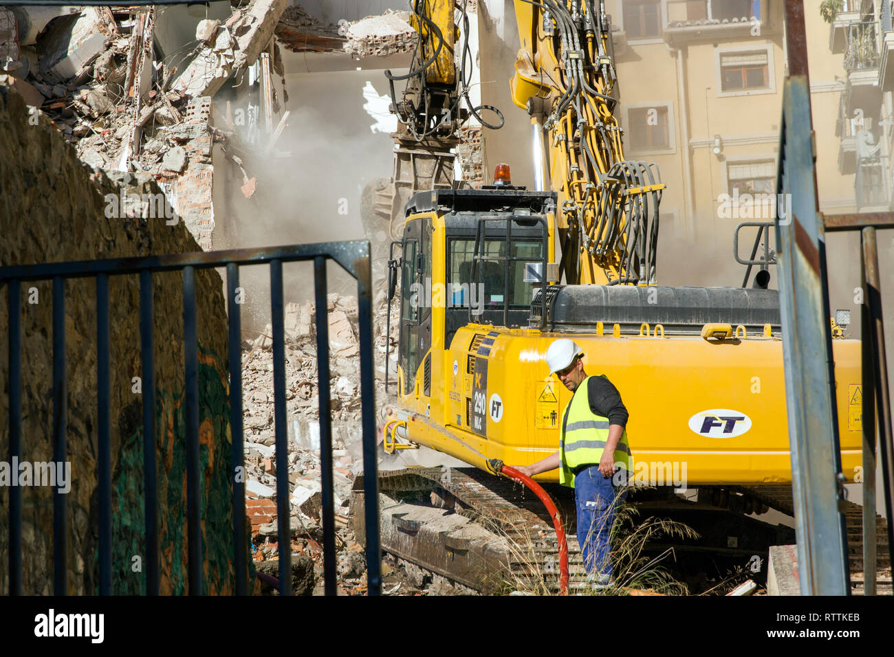 High reach Komatsu demolition Stock Photo - Alamy