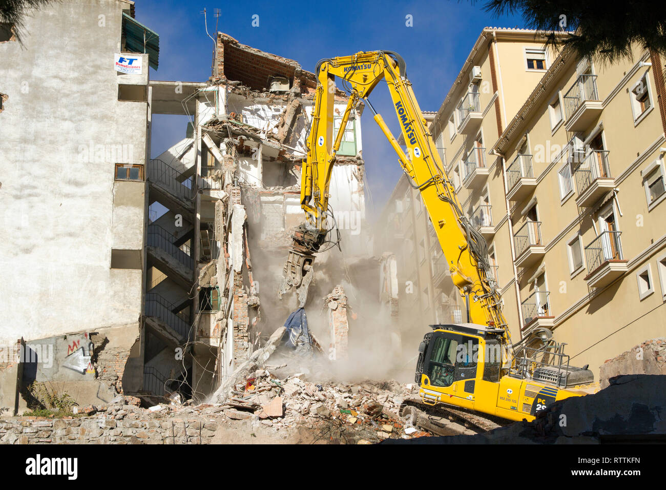 High reach Komatsu demolition Stock Photo - Alamy