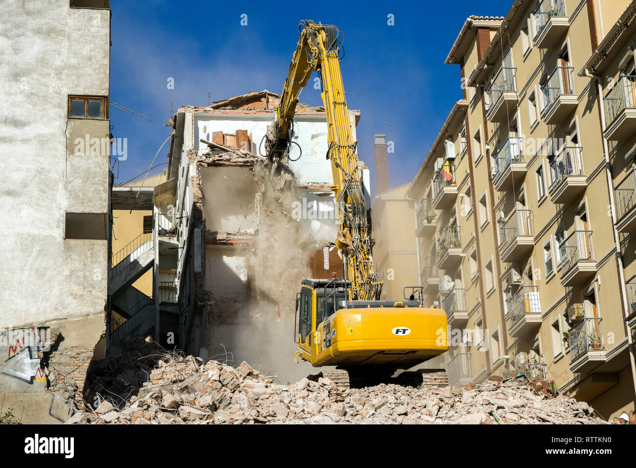 High reach Komatsu demolition Stock Photo - Alamy