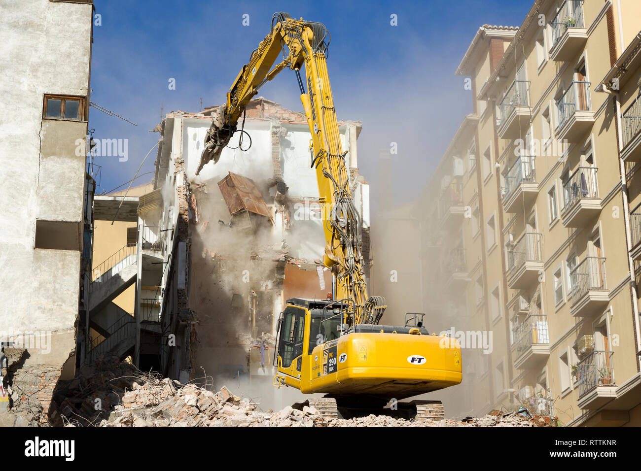 High reach Komatsu demolition Stock Photo - Alamy