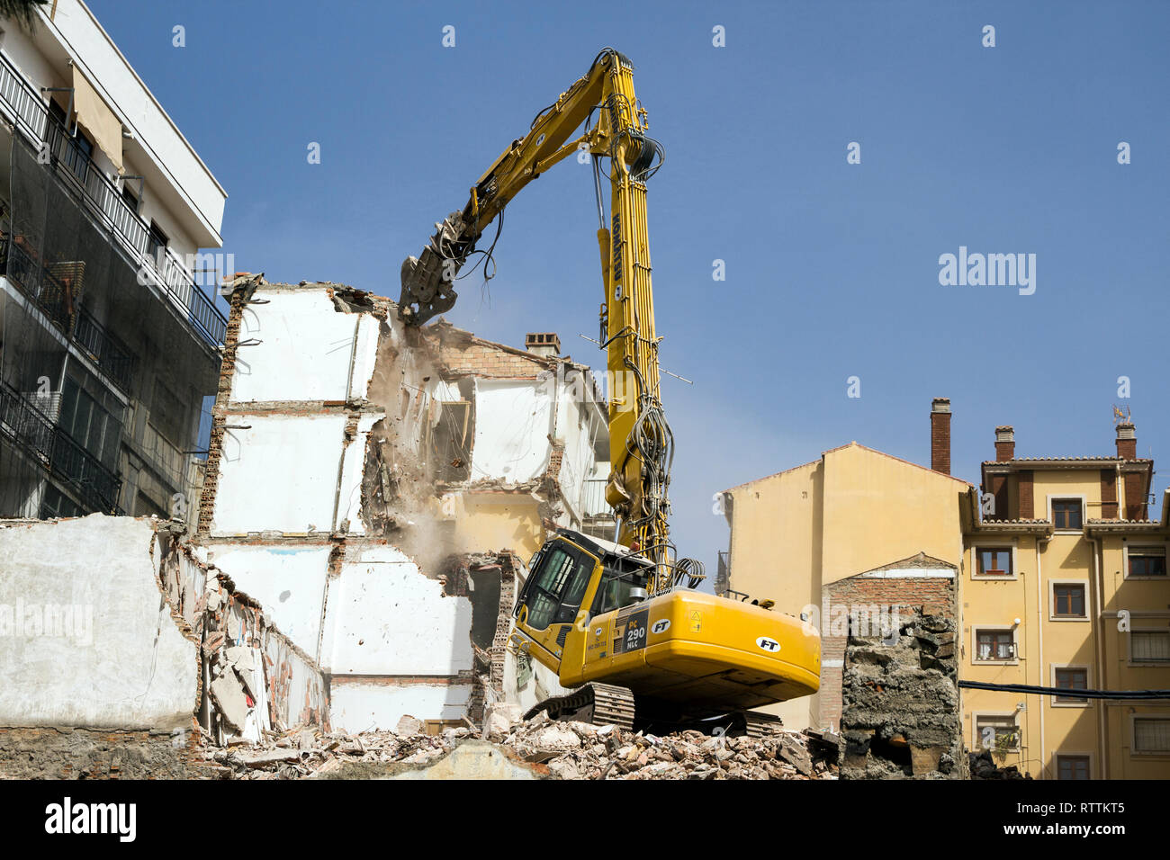 High reach Komatsu demolition Stock Photo - Alamy
