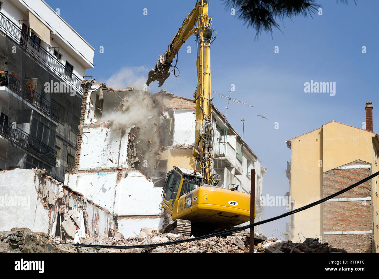 High reach Komatsu demolition Stock Photo - Alamy