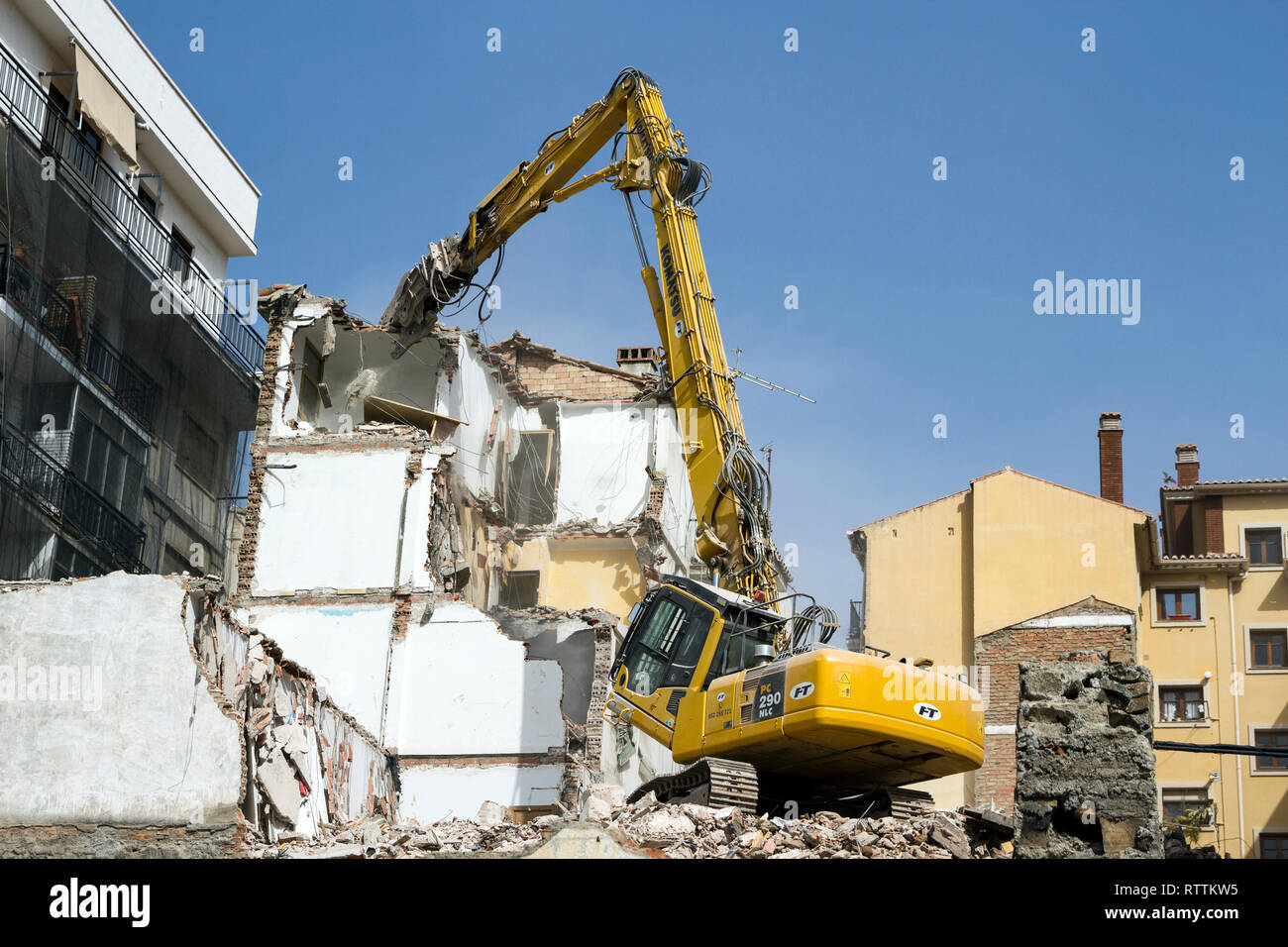 High reach Komatsu demolition Stock Photo - Alamy