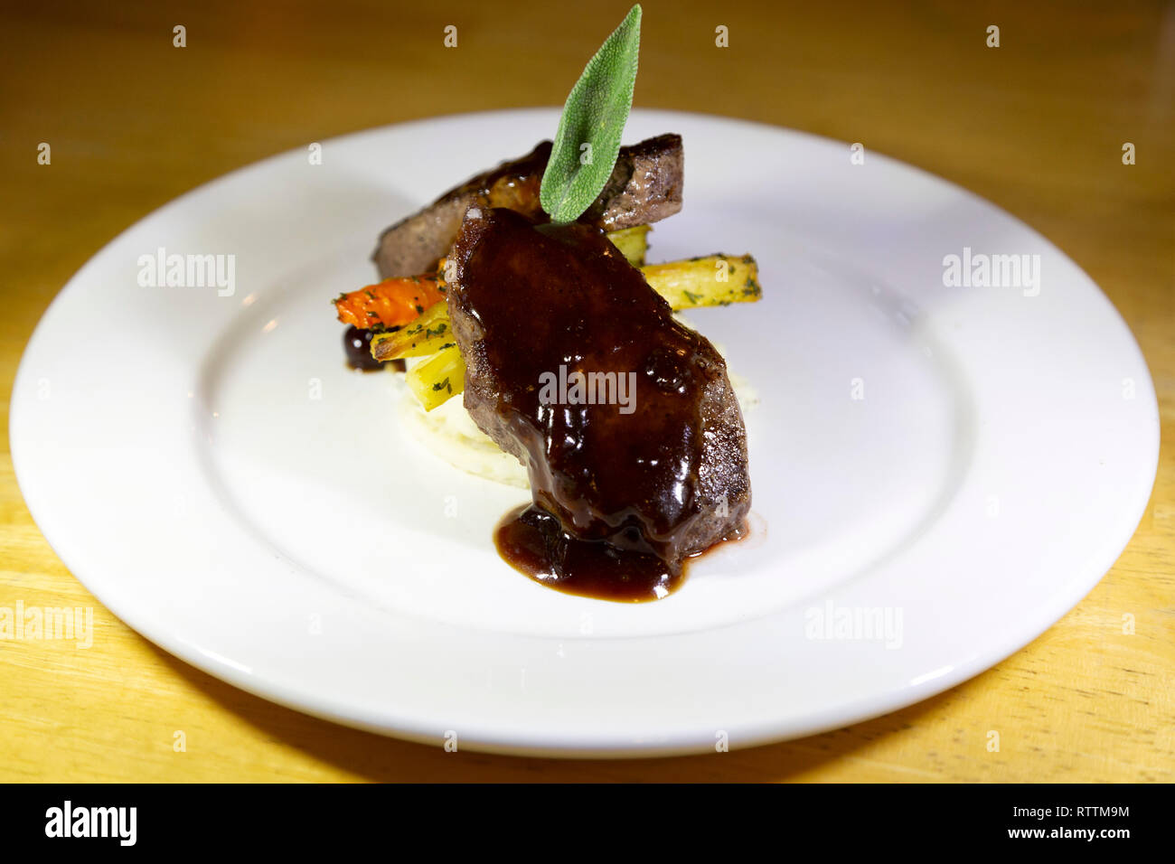 Steak covered with a jus and served in rural Manitoba, Canada. The meat ...