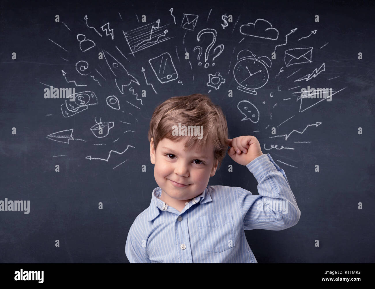 Smart little kid in front of a drawn up blackboard ruminate Stock Photo ...