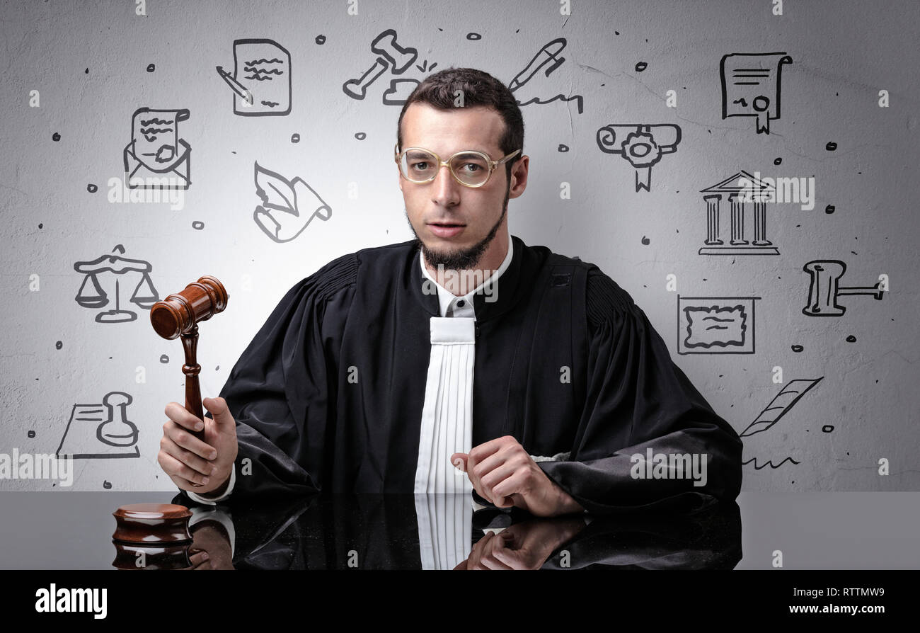 Handsome judge with court symbols around Stock Photo - Alamy