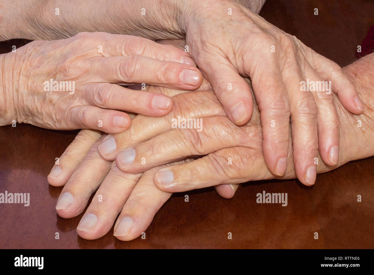 Old people holding hands. Closeup Stock Photo - Alamy