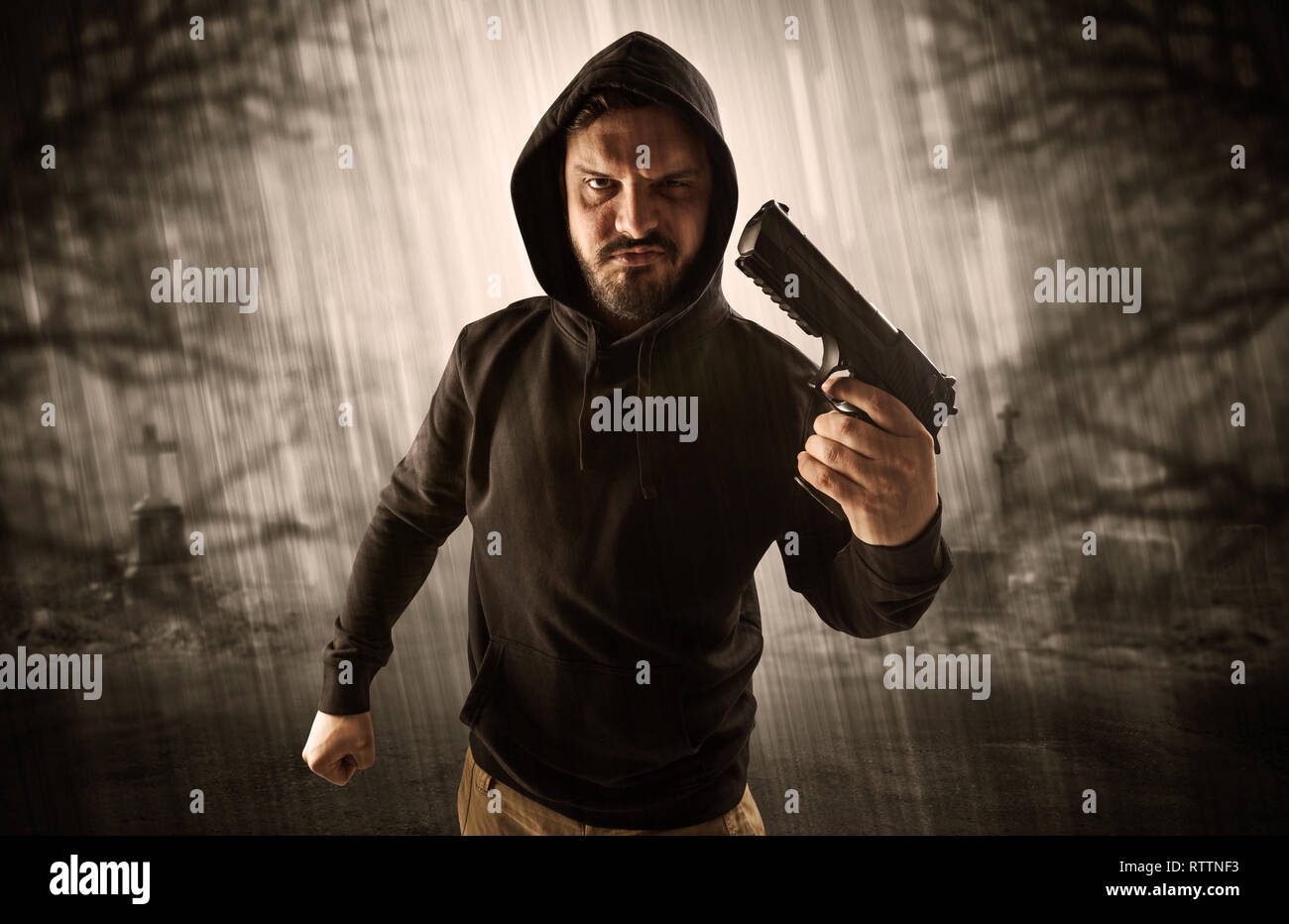 Armed aggressive hunter in abandoned thick forest graveyard concept ...