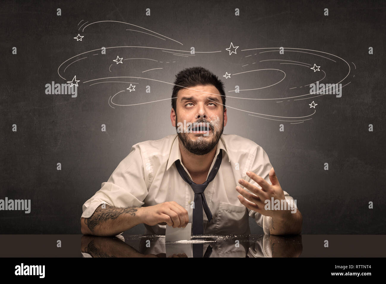 Young drunk man at his office with doodles around Stock Photo - Alamy