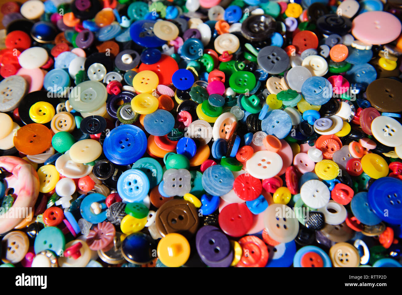 Lot of colorful plastic clothing buttons. Many small round vintage ...
