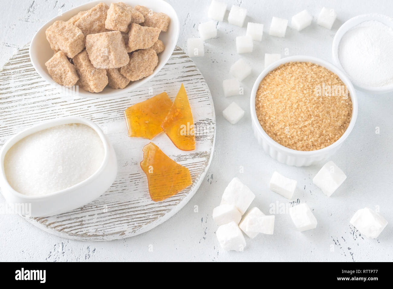 Different kinds of sugar on the wooden background Stock Photo - Alamy