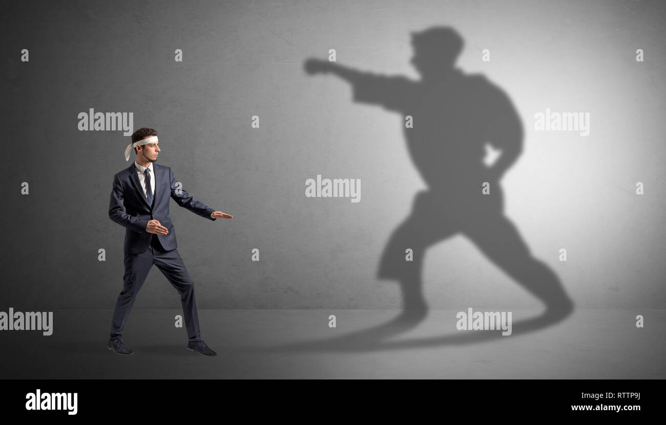 Young karate man confronting with his own shadow Stock Photo - Alamy