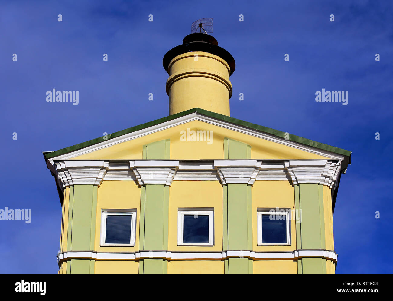 Top of the building with a round small turret and an antenna on the ...