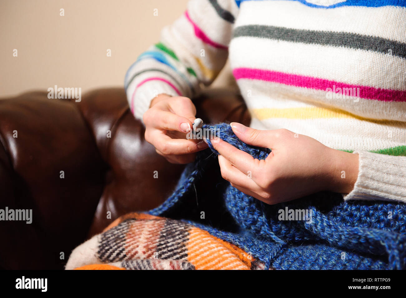 Women's hands knitting. Close up of hands knitting. Process of knitting ...