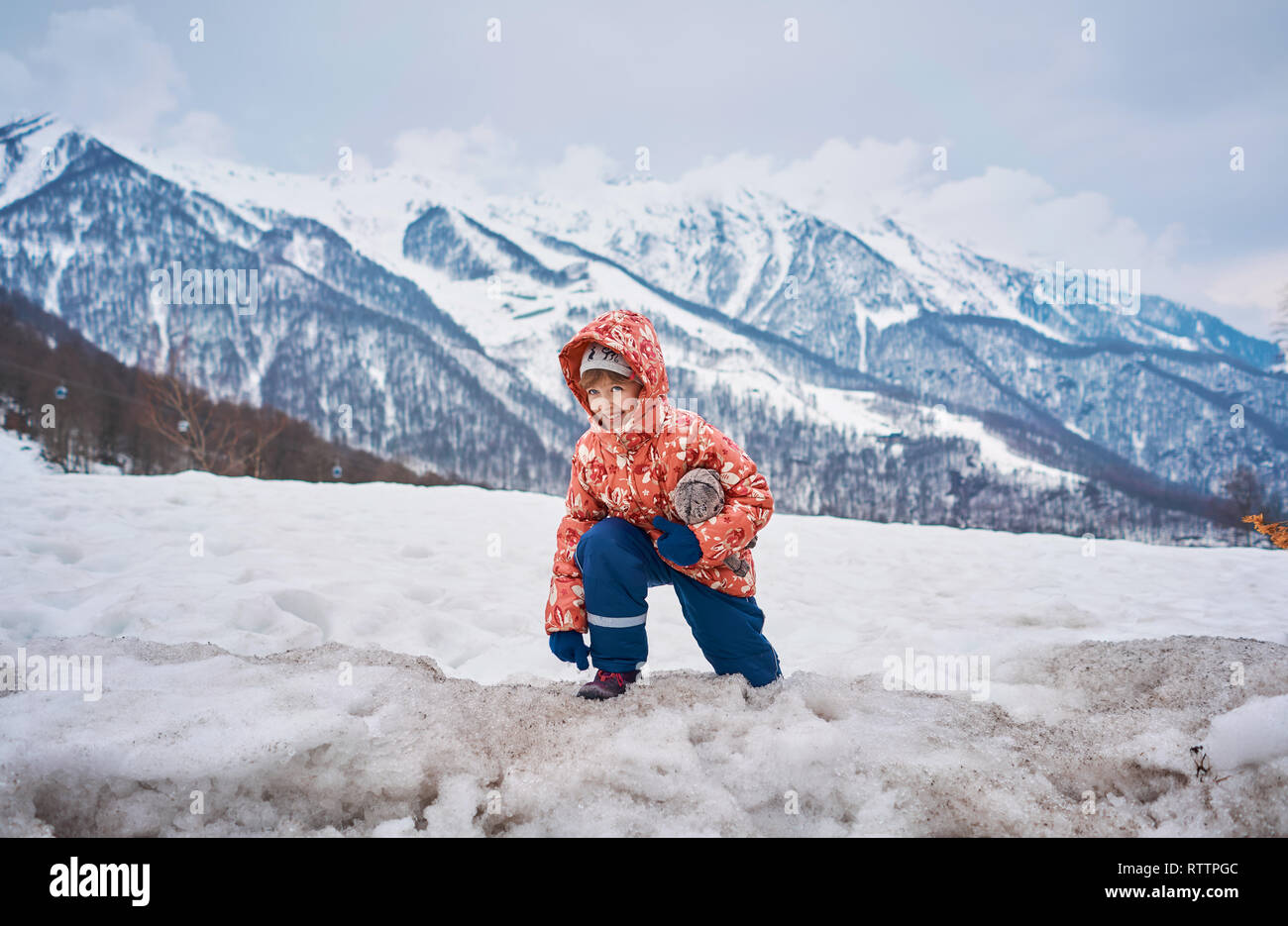 little girl in winter in the mountains Stock Photo - Alamy