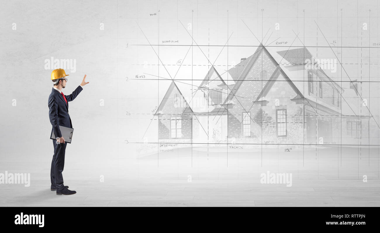 Architect standing and watching an imagined house plan Stock Photo - Alamy