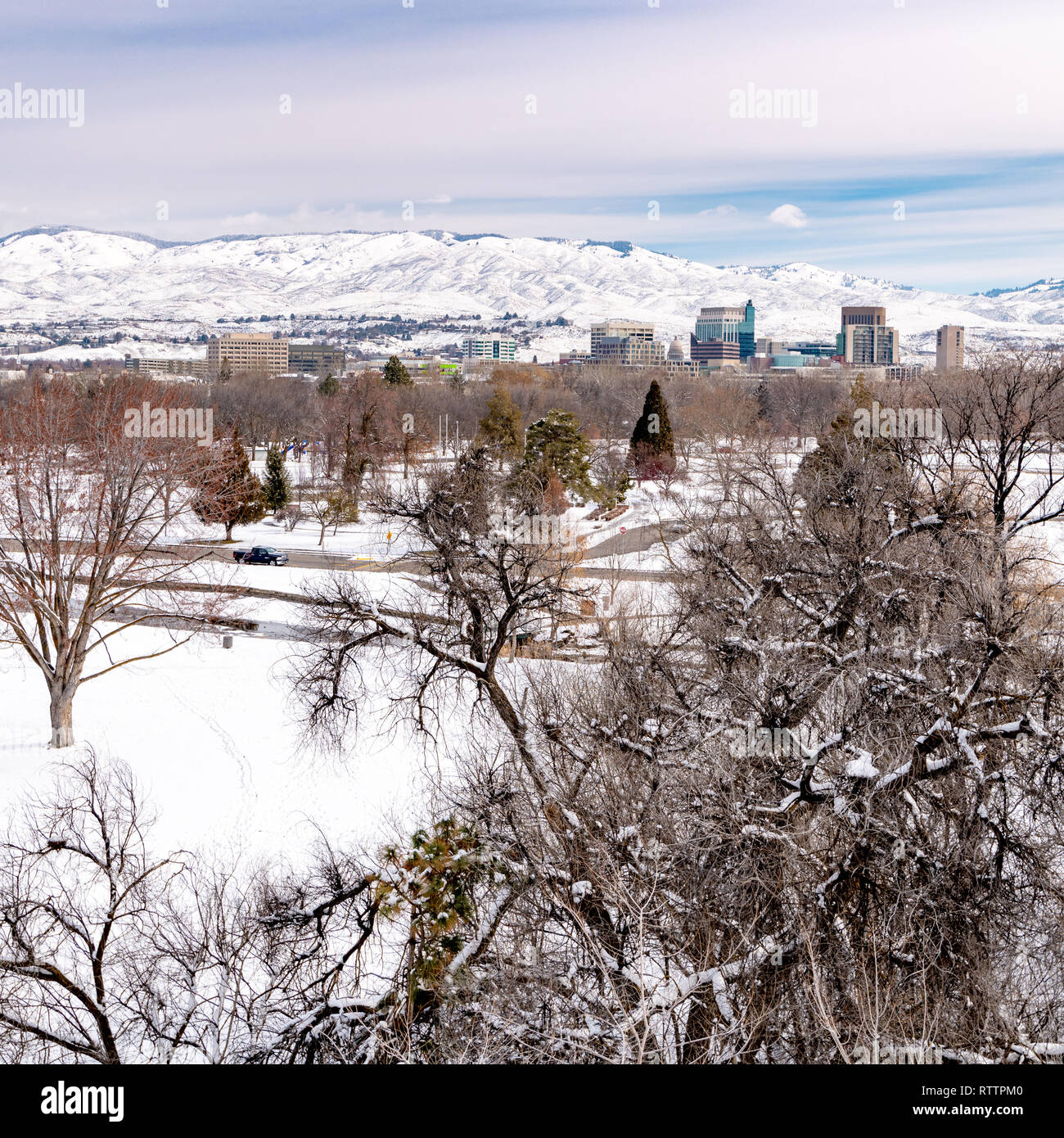 Winter snow covers city park with snow with Boise skyline Stock Photo ...