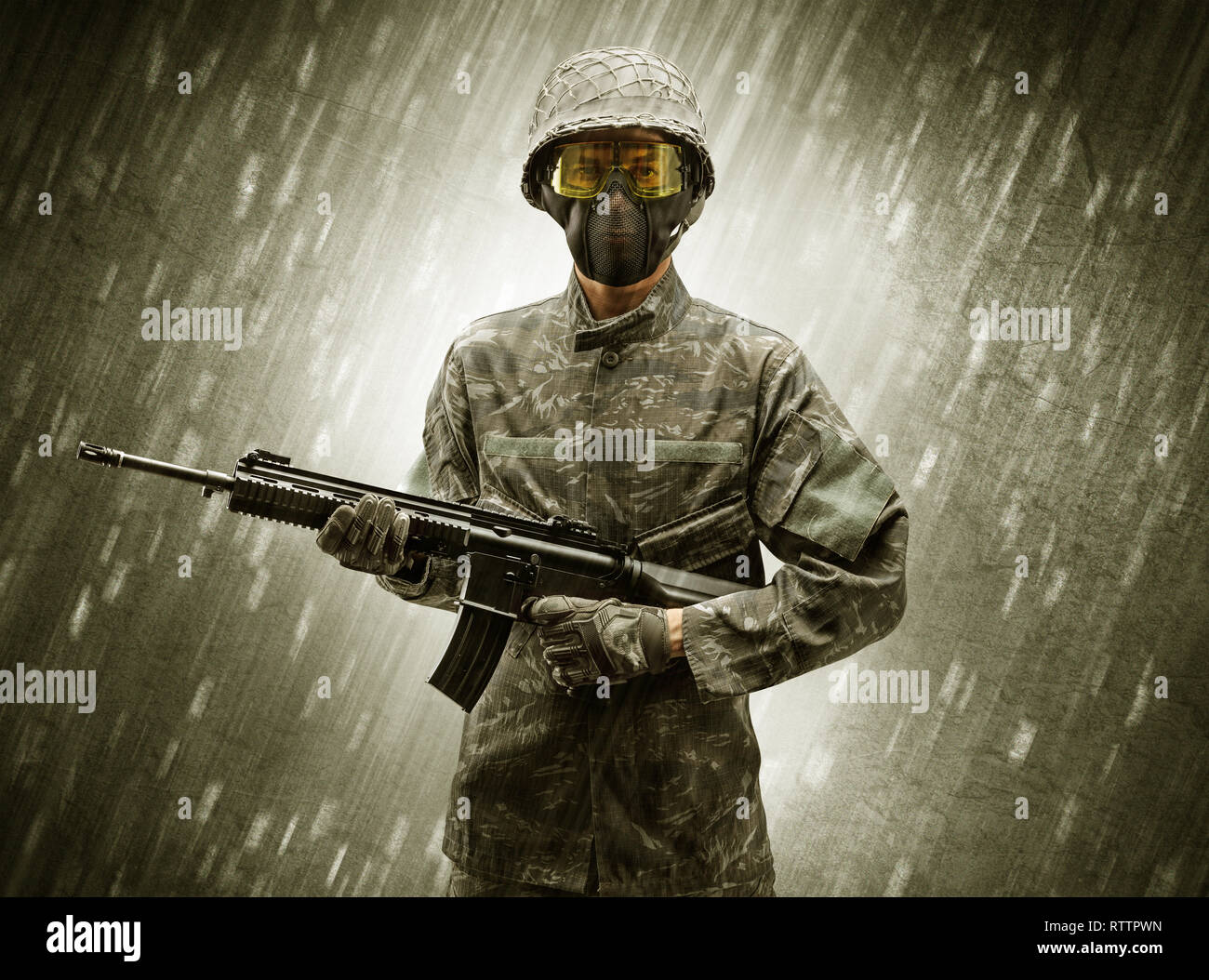 Armed soldier standing in rainy weather Stock Photo - Alamy