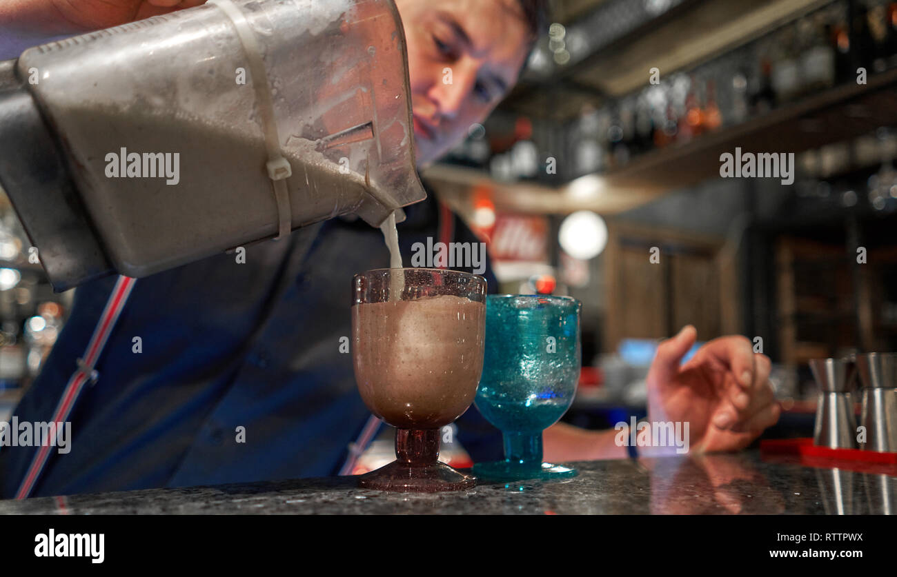 bartender pours a cocktail at the bar Stock Photo - Alamy