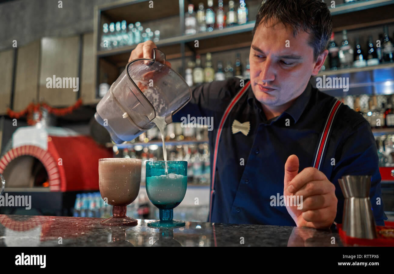 bartender pours a cocktail at the bar Stock Photo - Alamy