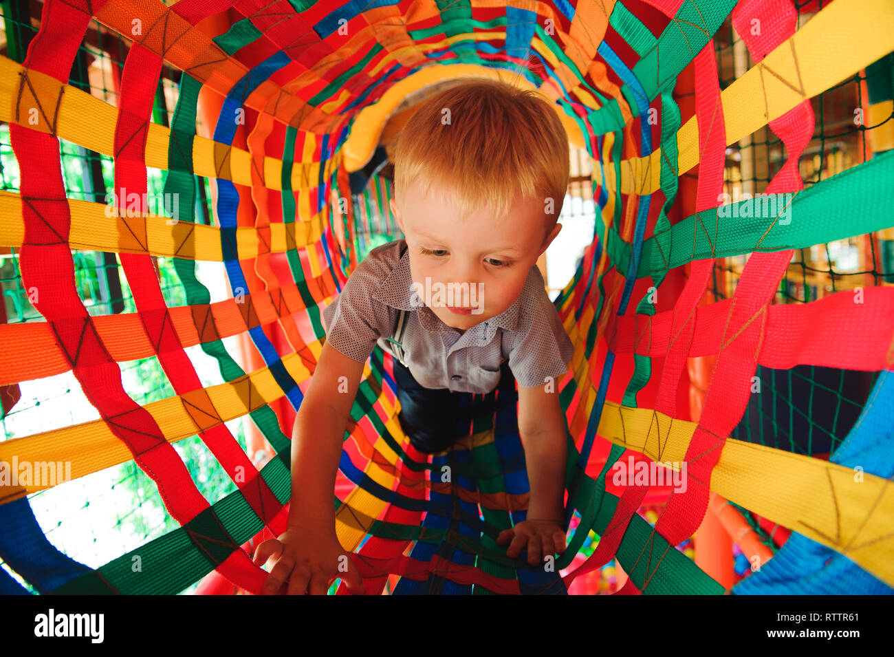 Boy playing on the playground, in the children's maze Stock Photo - Alamy